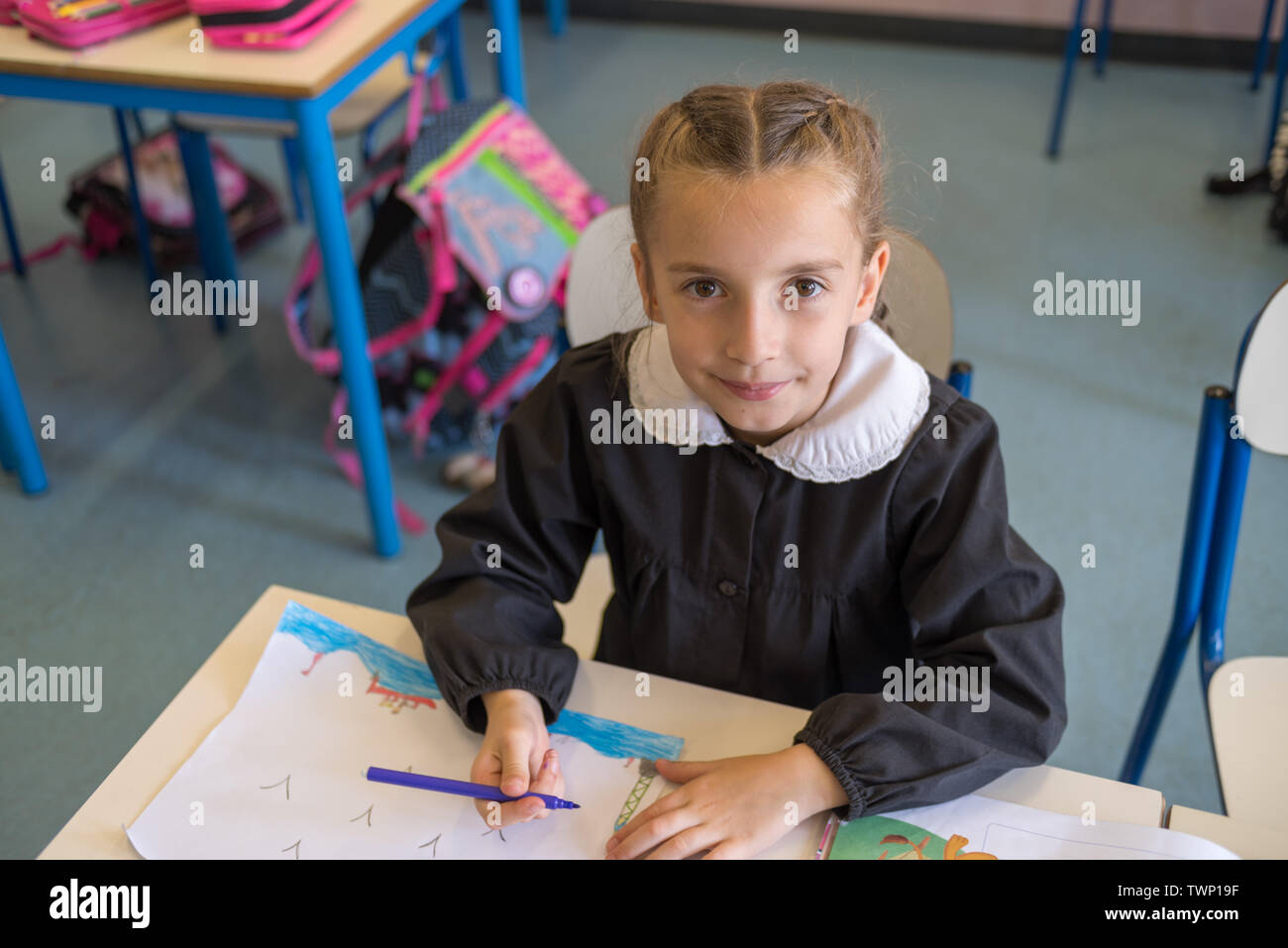 Elementary school student in classroom Stock Photo - Alamy