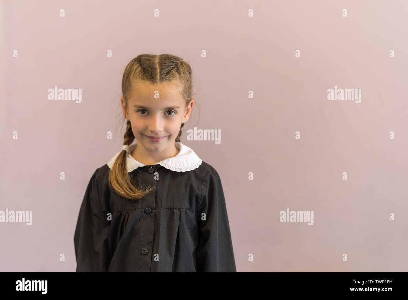 Pretty elementary school girl posing at camera Stock Photo - Alamy
