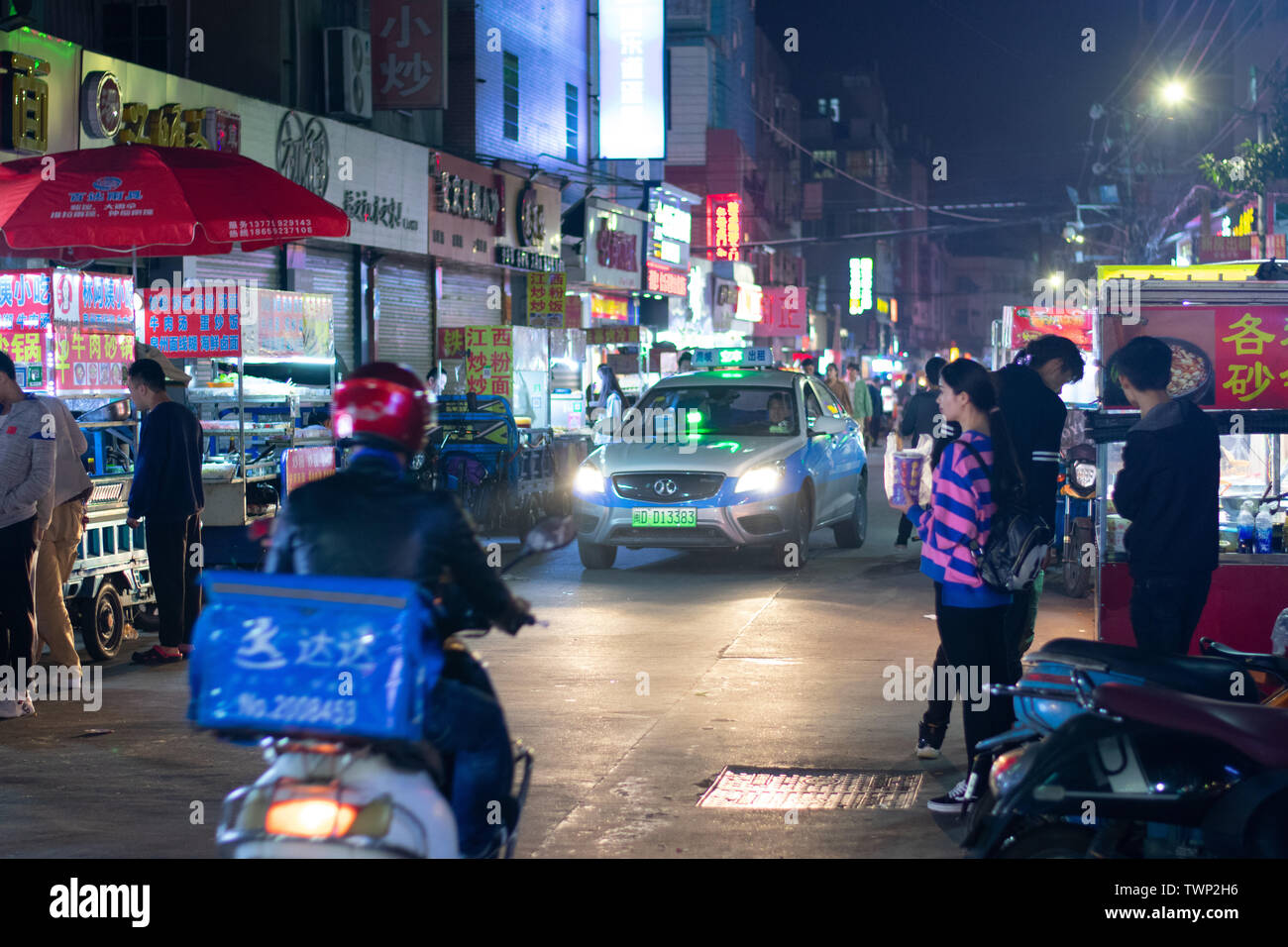 Busy city night life in downtown xiamen, china Stock Photo - Alamy