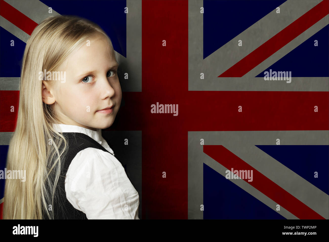 Cute child girl student against the UK flag background. English ...