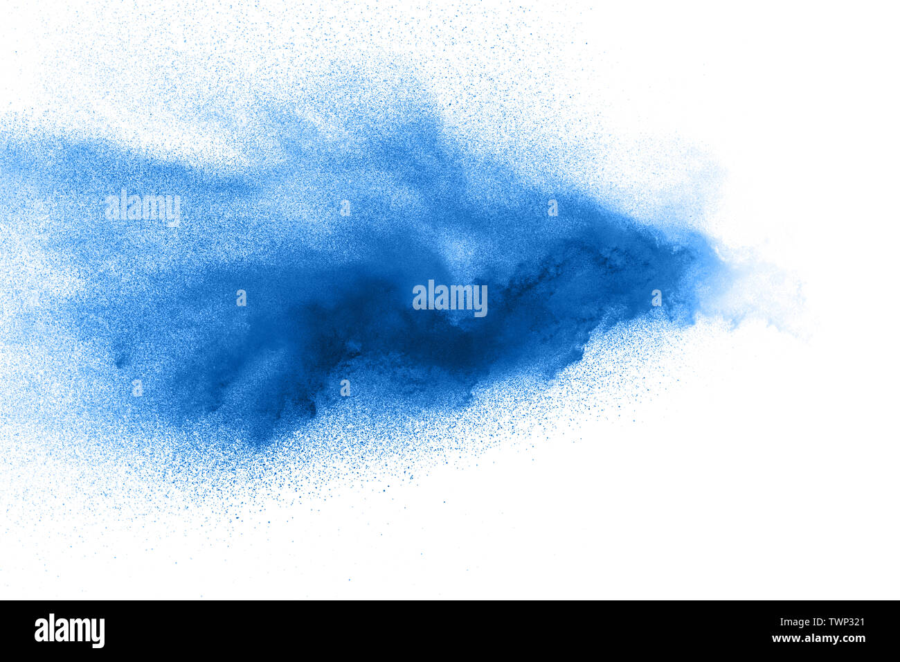 Abstract blue color of powder explosion on white background.Blue dust ...