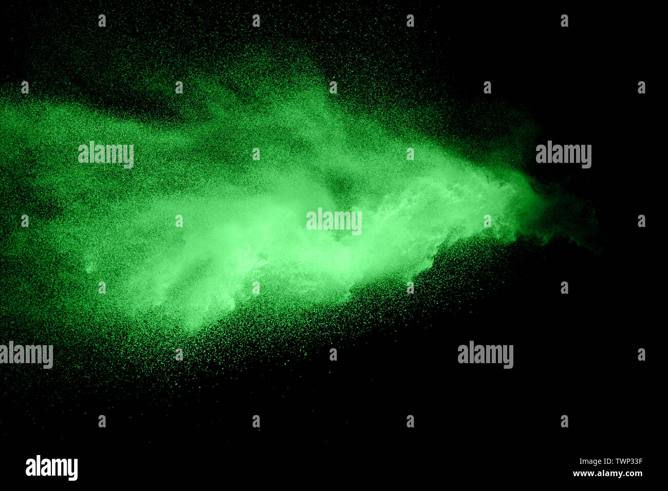 abstract green dust explosion on black background.abstract green powder ...