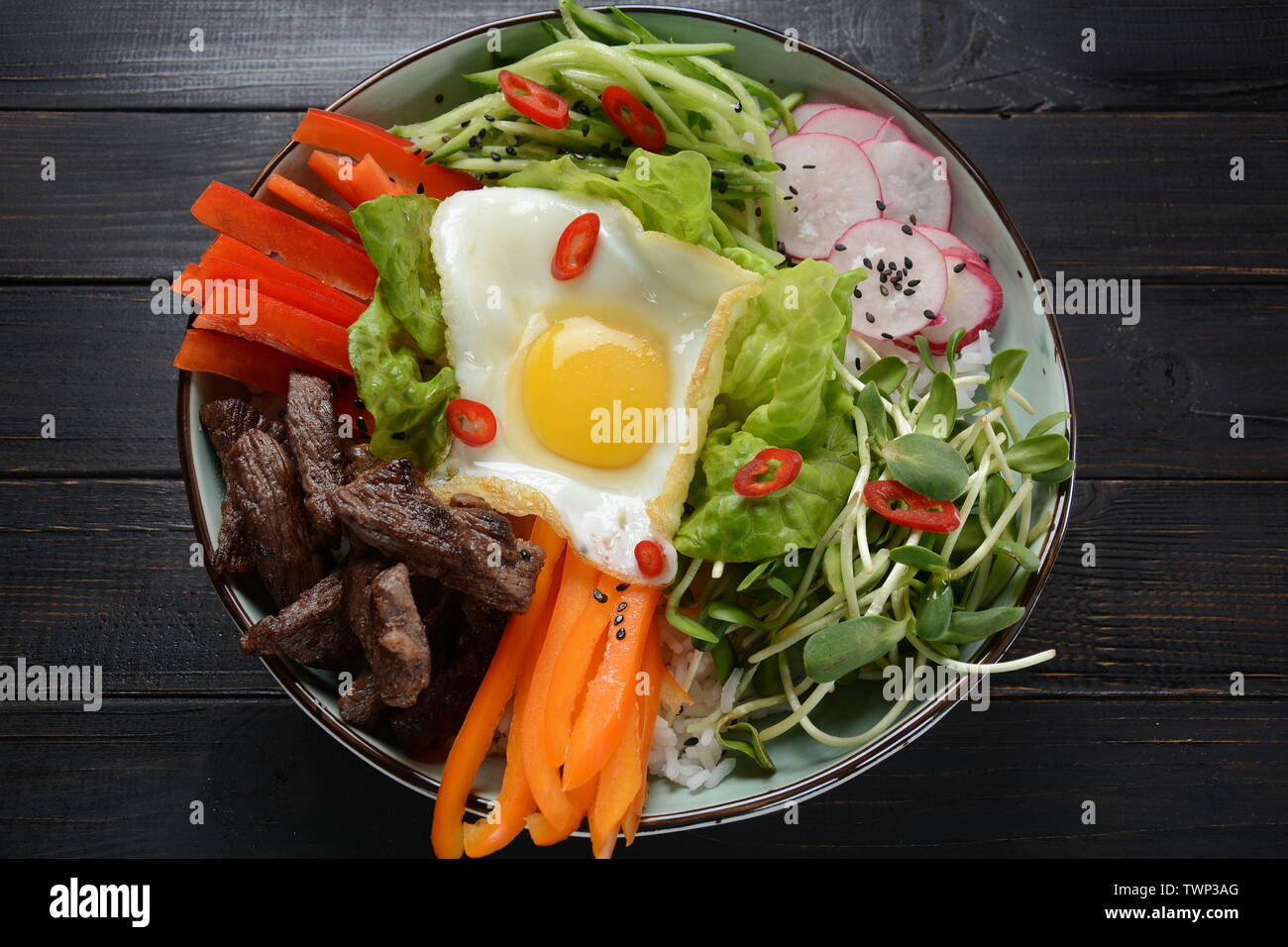 Bibimbub. Bibimbab.Fried egg beef and vegetables. Homemade traditional ...