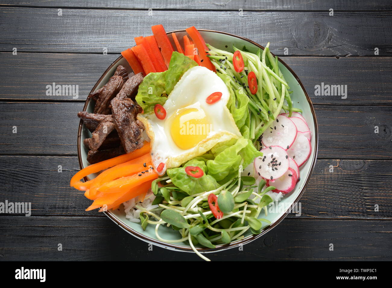 Bibimbub. Bibimbab.Fried egg beef and vegetables. Homemade traditional ...