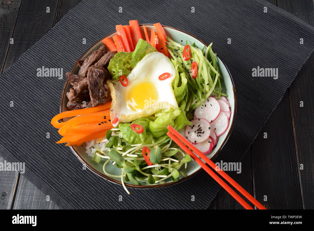 Bibimbub. Bibimbab.Fried egg beef and vegetables. Homemade traditional ...