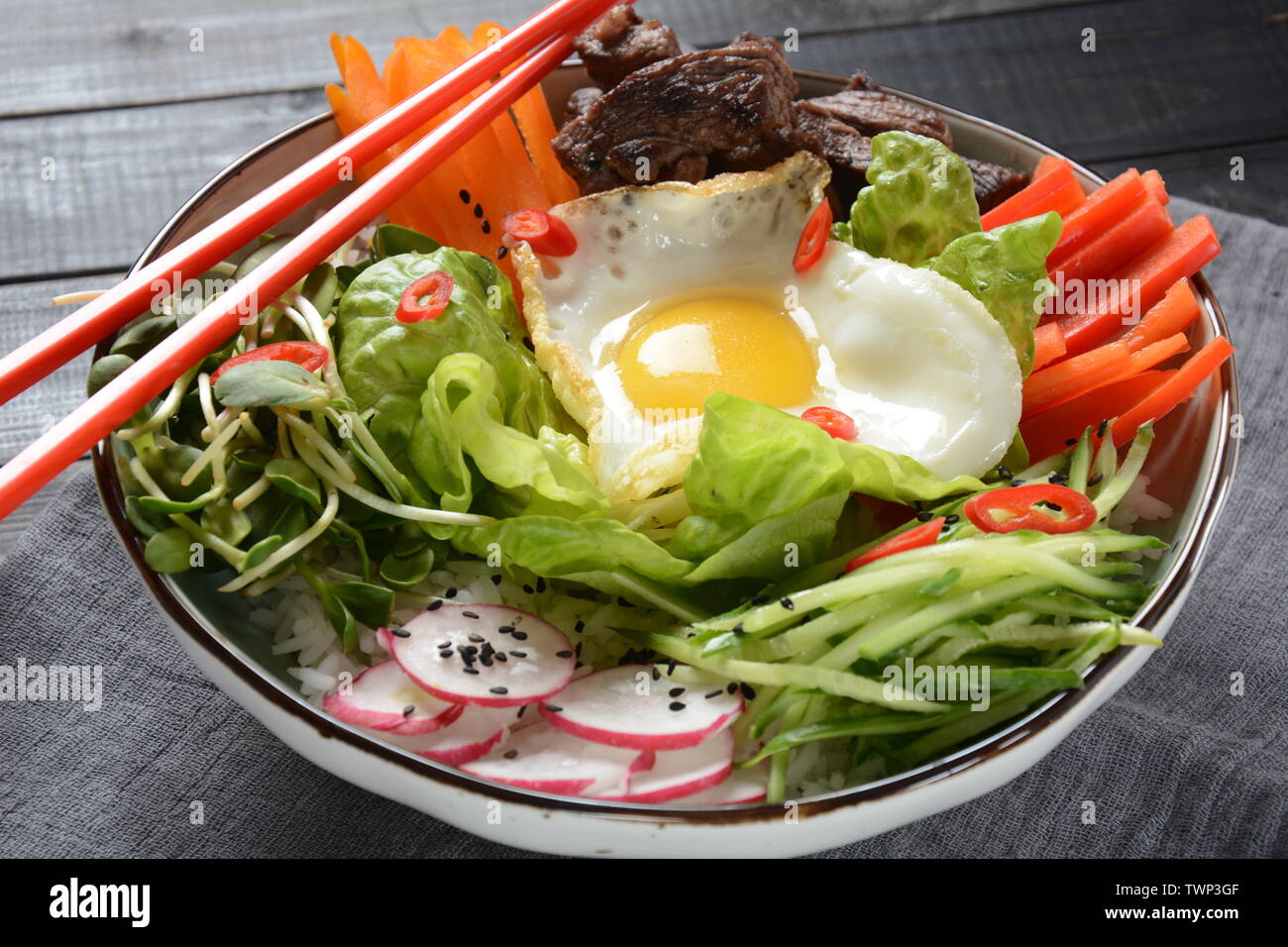 Bibimbub. Bibimbab.Fried egg beef and vegetables. Homemade traditional ...