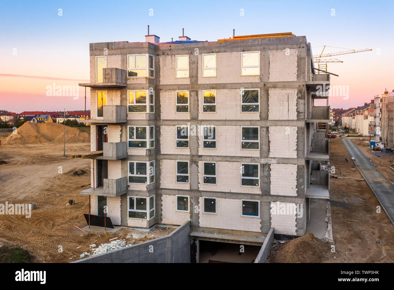 Modern apartment building on a construction site Stock Photo - Alamy