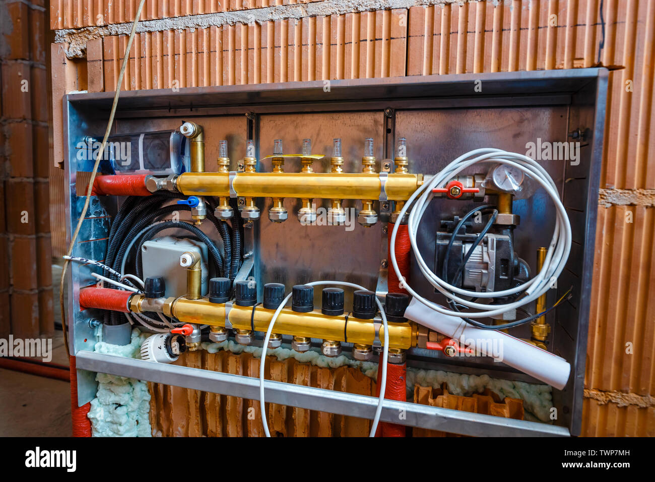 Close up on water floor heating system interior Stock Photo - Alamy