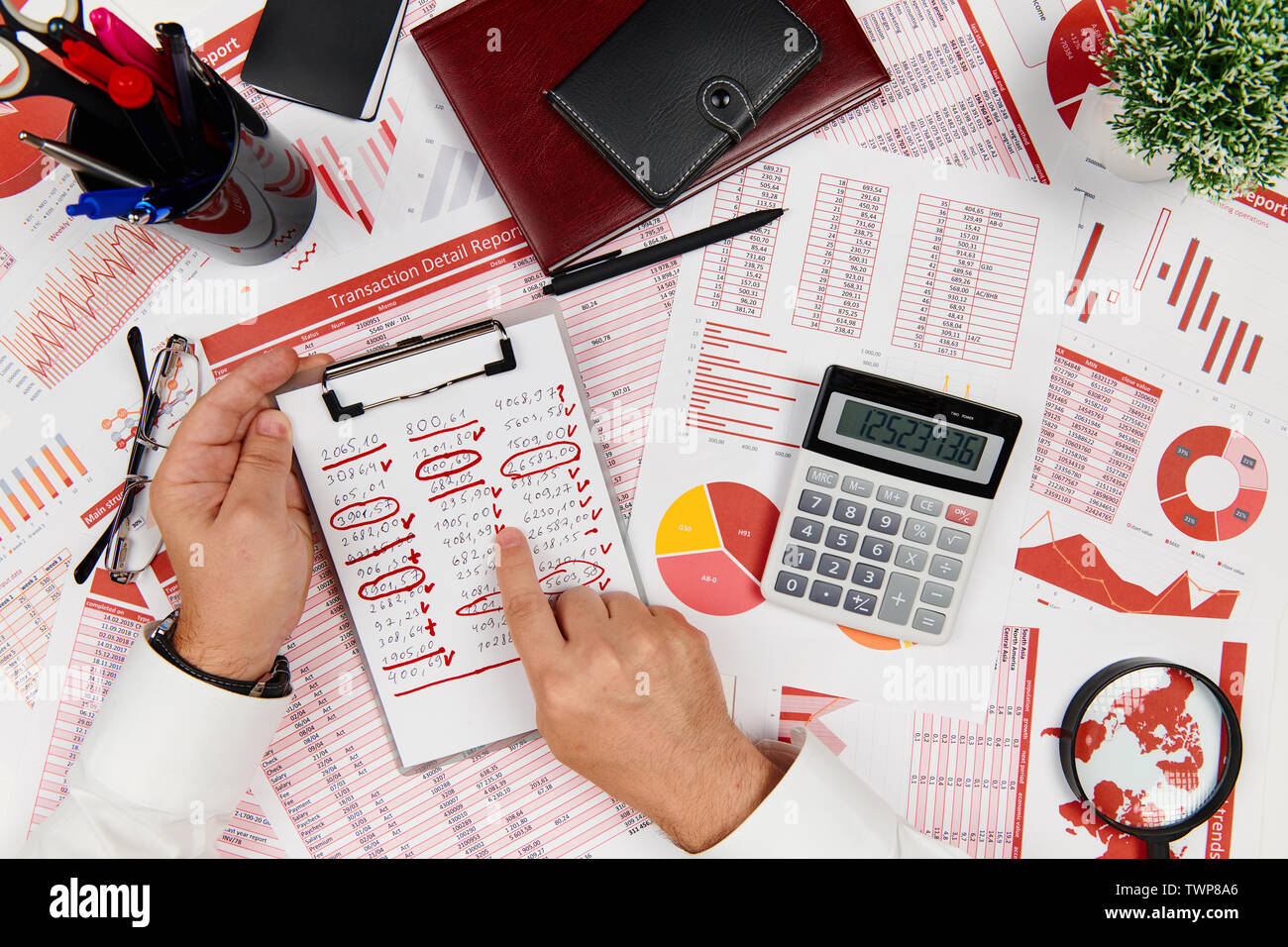 Business reports, data tables and charts - directly above view of ...