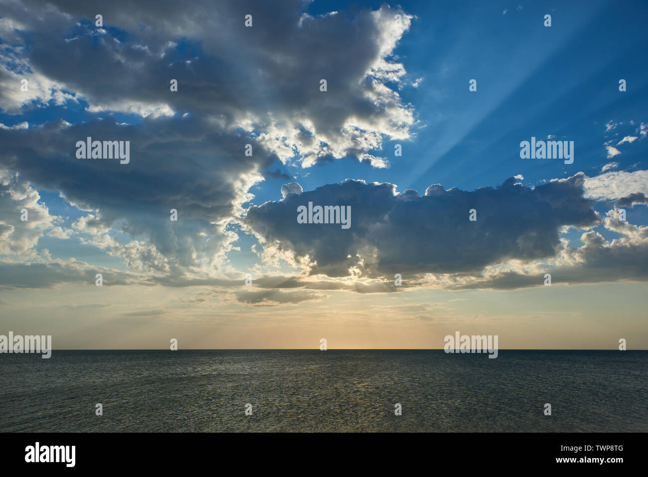 Sunset with light rays on the sea hi-res stock photography and images ...