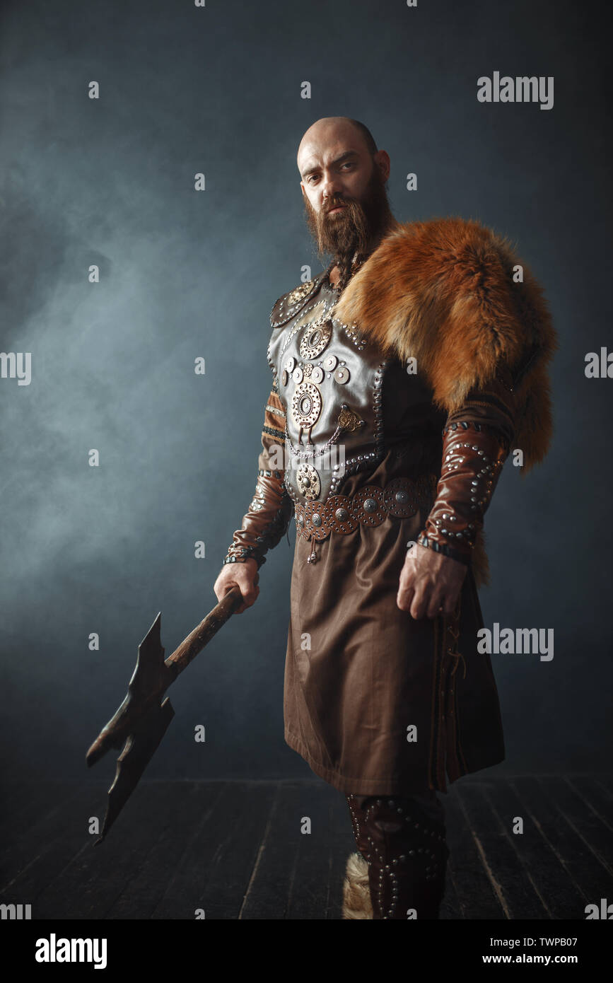 Viking with axe, barbarian, side view Stock Photo - Alamy