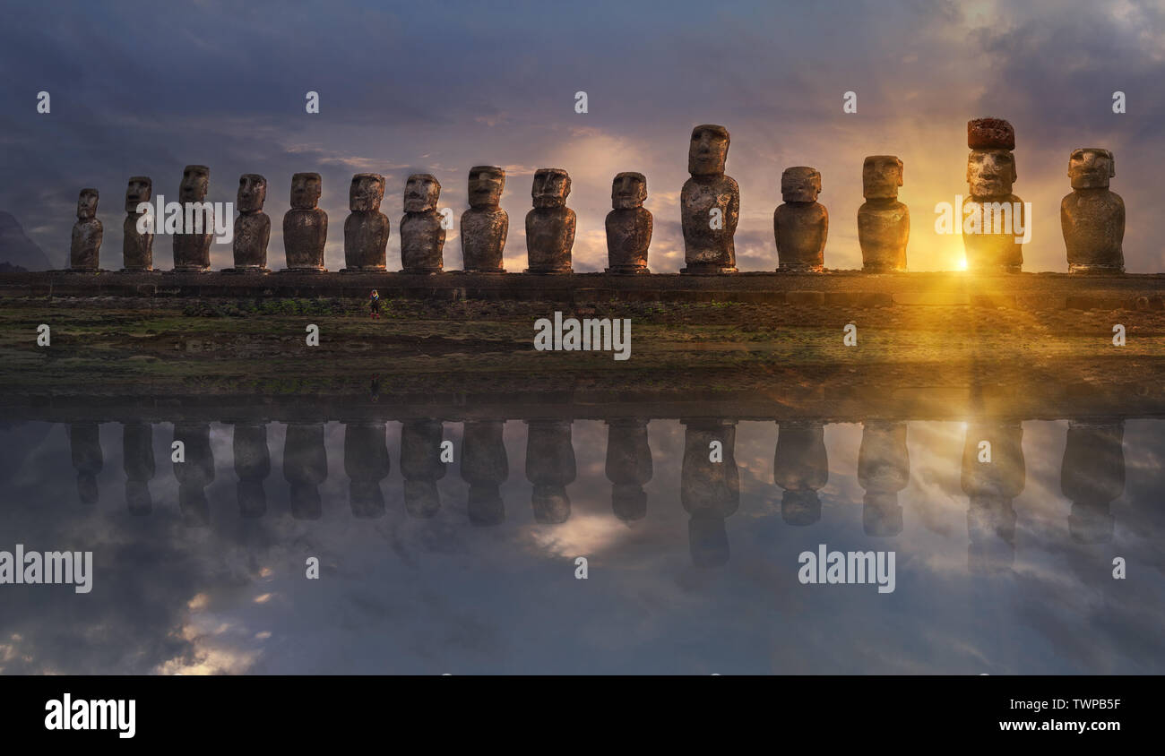 The first rays of the rising sun illuminate the gigantic idols of ...