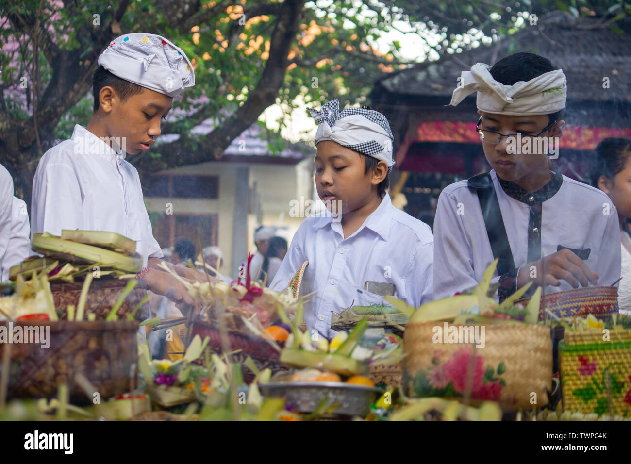 DENPASAR,BALI/INDONESIA - May 11 2019: Three Balinese kids, wearing ...