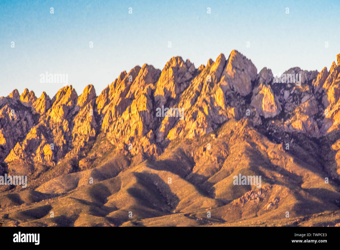 Afternoon sun highlighting the western slopes of the Organ Mountains ...