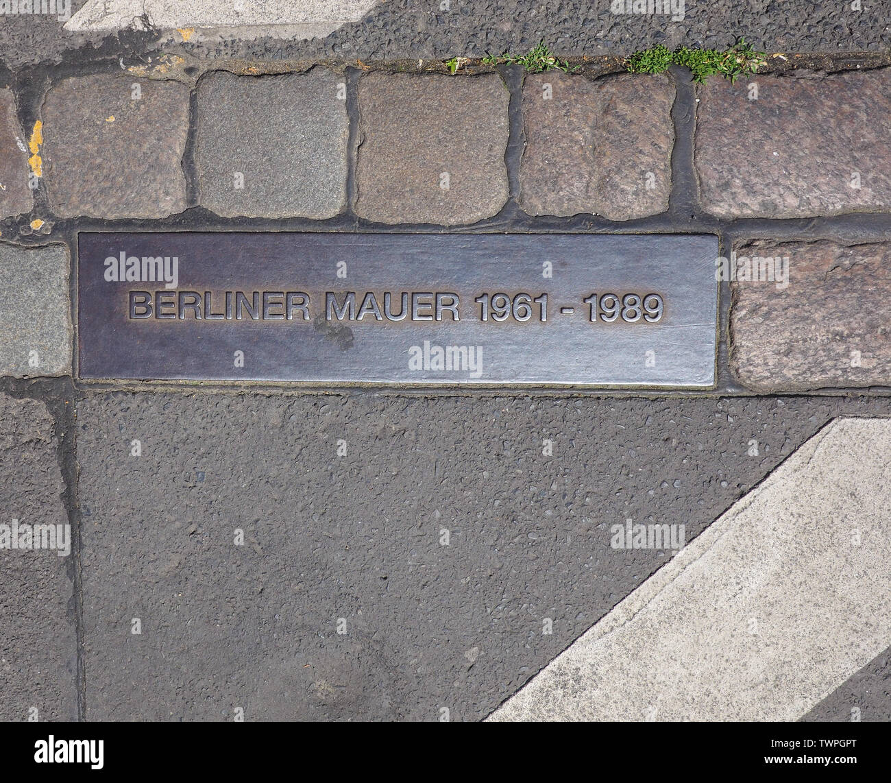 Berliner Mauer (meaning Berlin Wall) sign in a Berlin street pavement ...