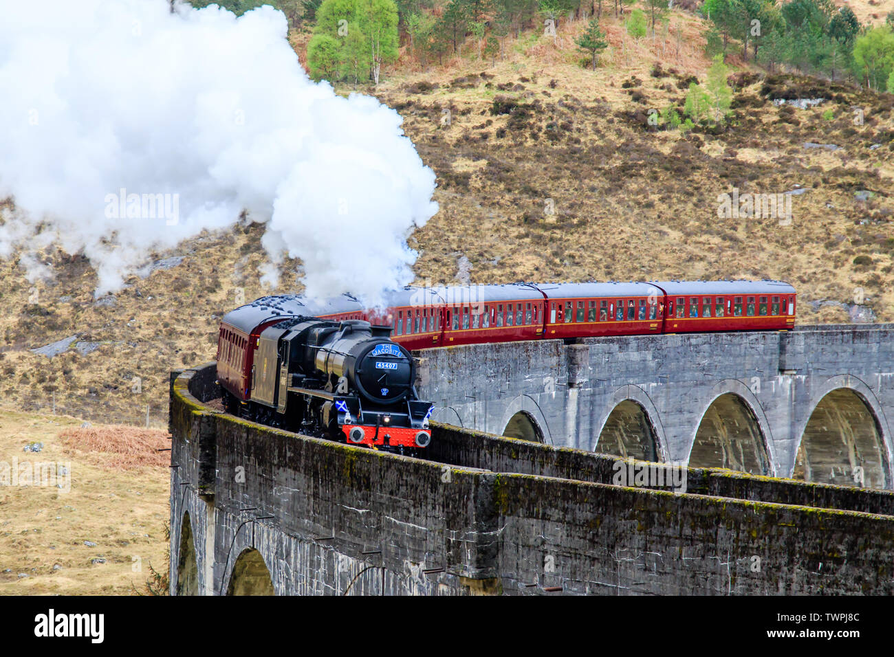 Jacobite steam Train crossing the Glenfinnan viaduct Stock Photo - Alamy