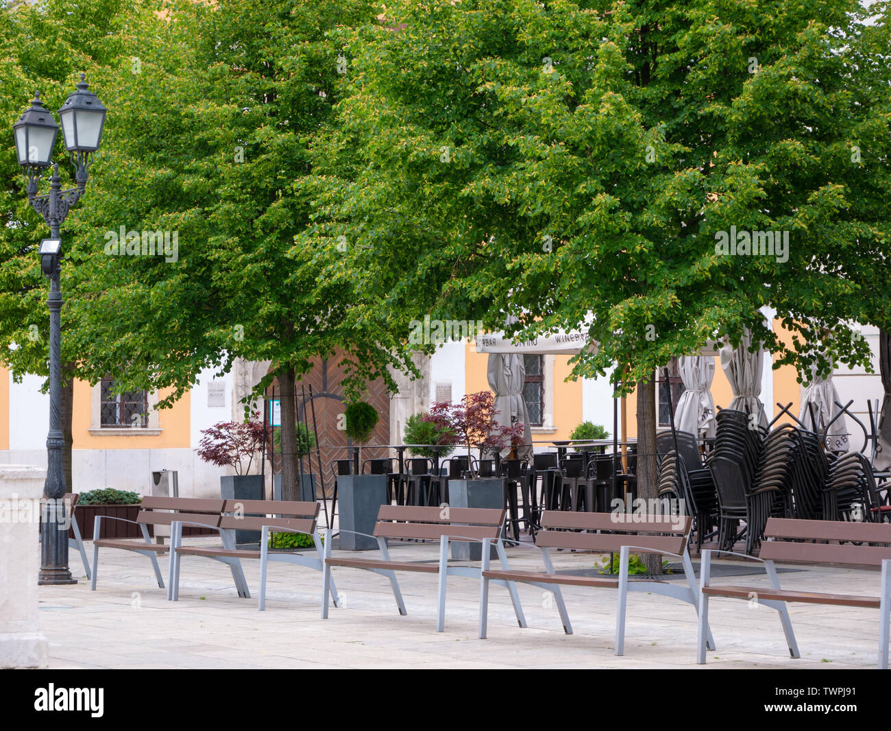 lamps and benches in the Szechenyi square in Gyor Stock Photo - Alamy