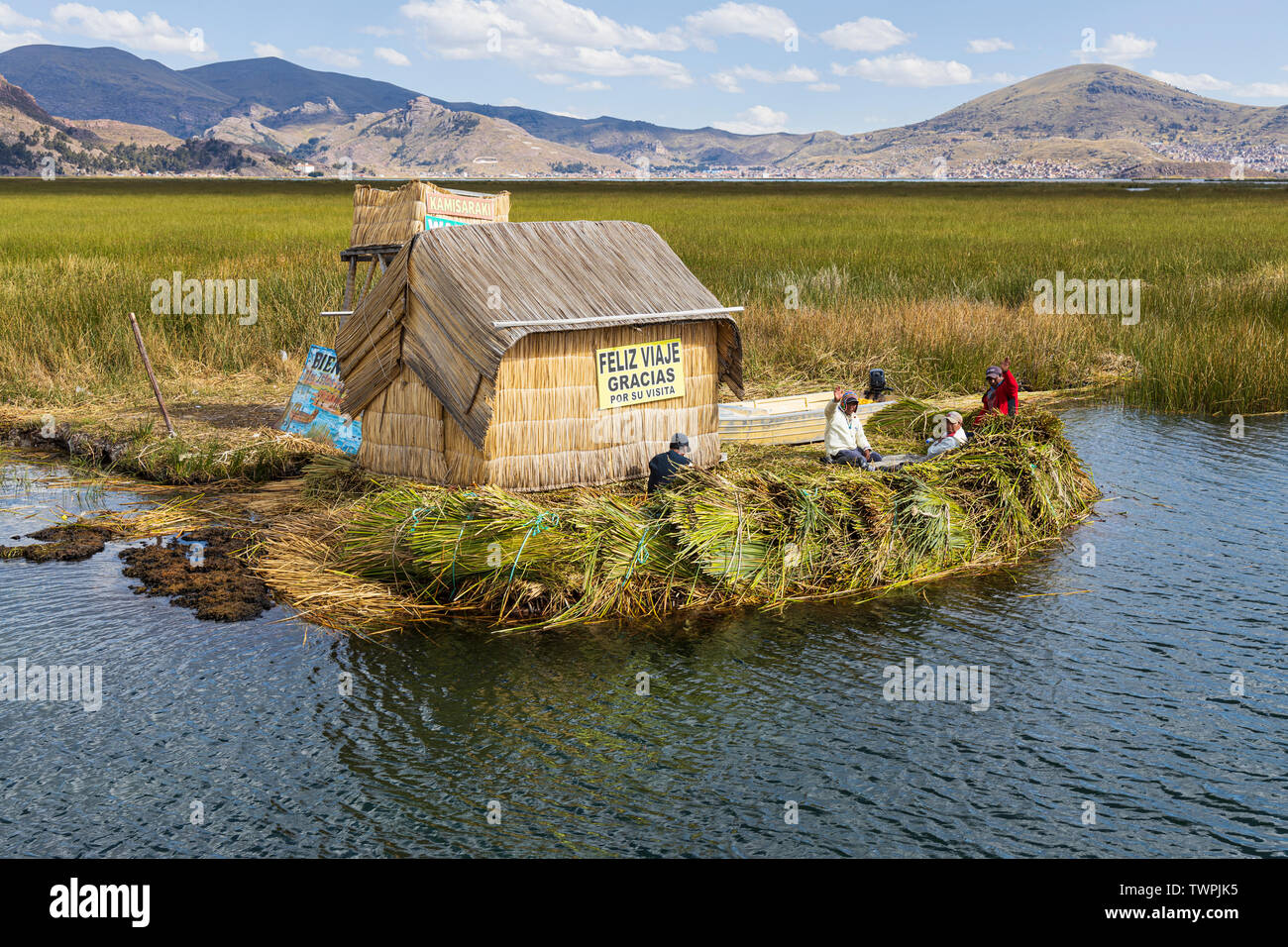 Boating through the reeds and floating villages of Uros islands on Lake ...