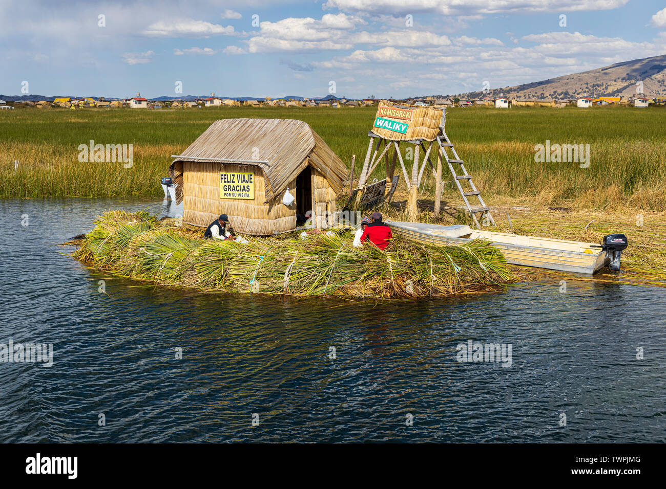 Boating through the reeds and floating villages of Uros islands on Lake ...
