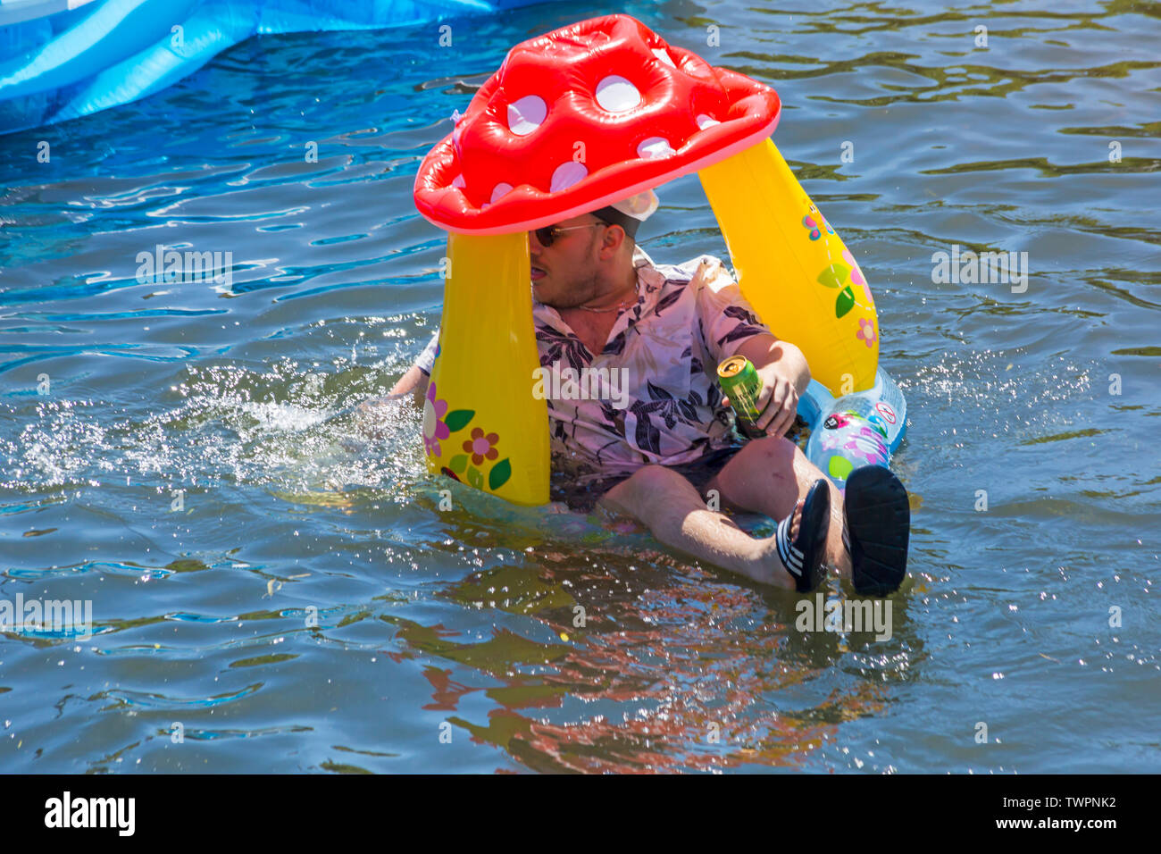 Sitting in inflatable mushroom pool hi-res stock photography and images ...