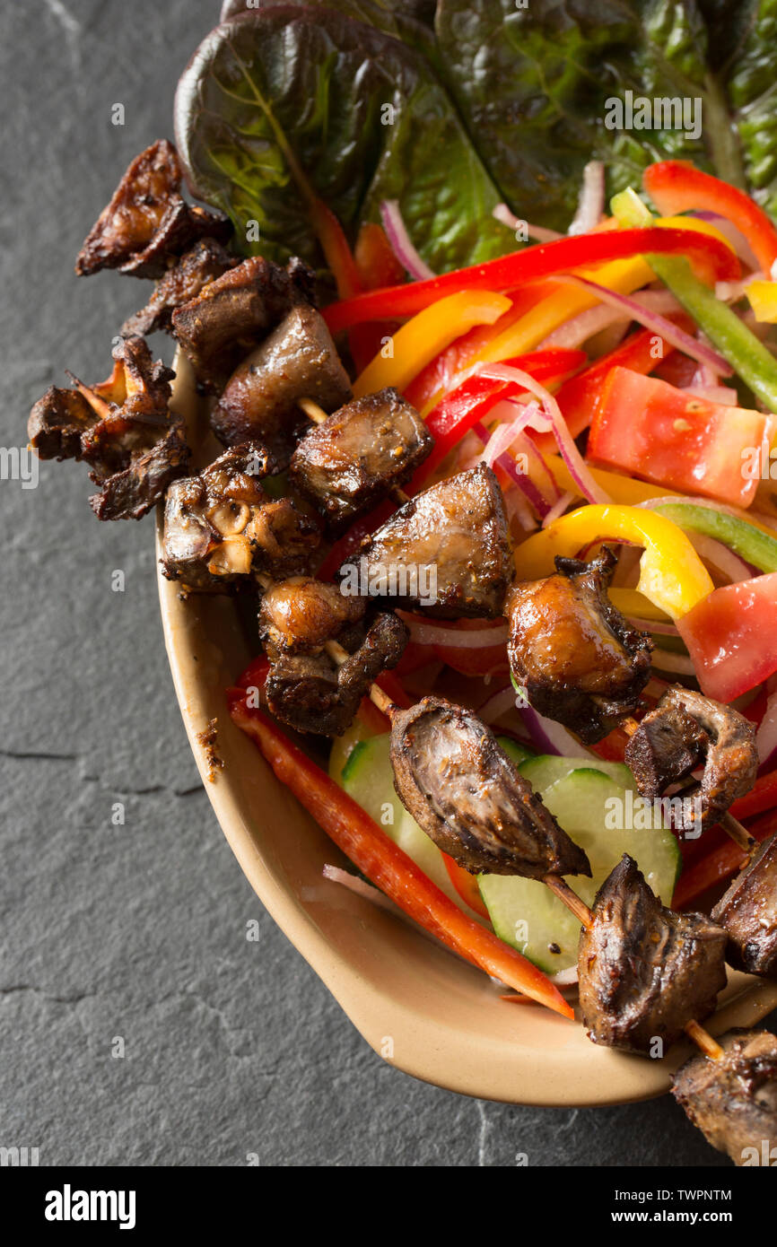 Grilled, sliced chunks of a British lamb’s heart that have been cooked ...