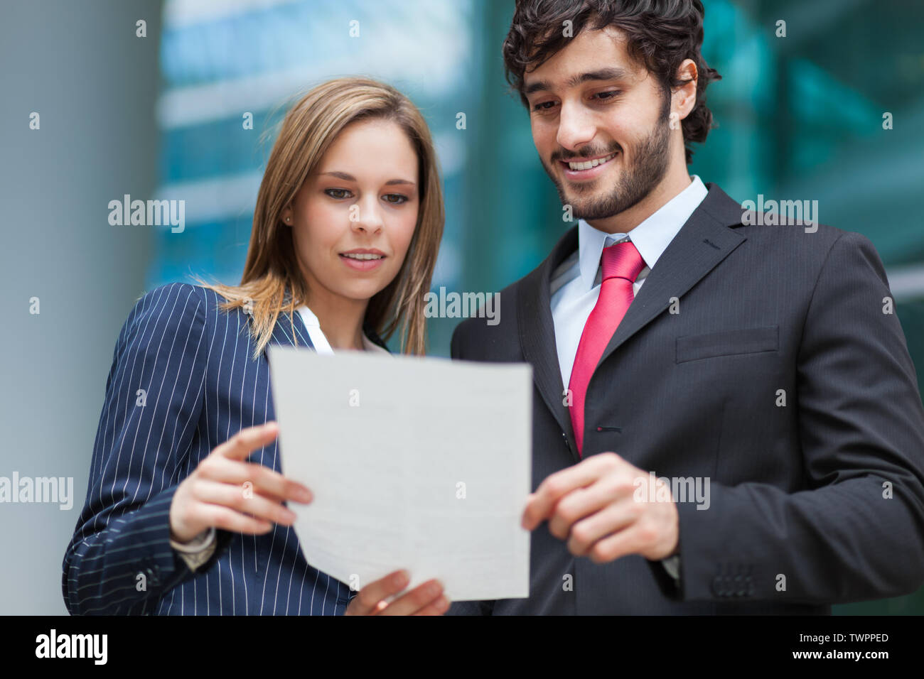 Business people looking financial charts hi-res stock photography and ...