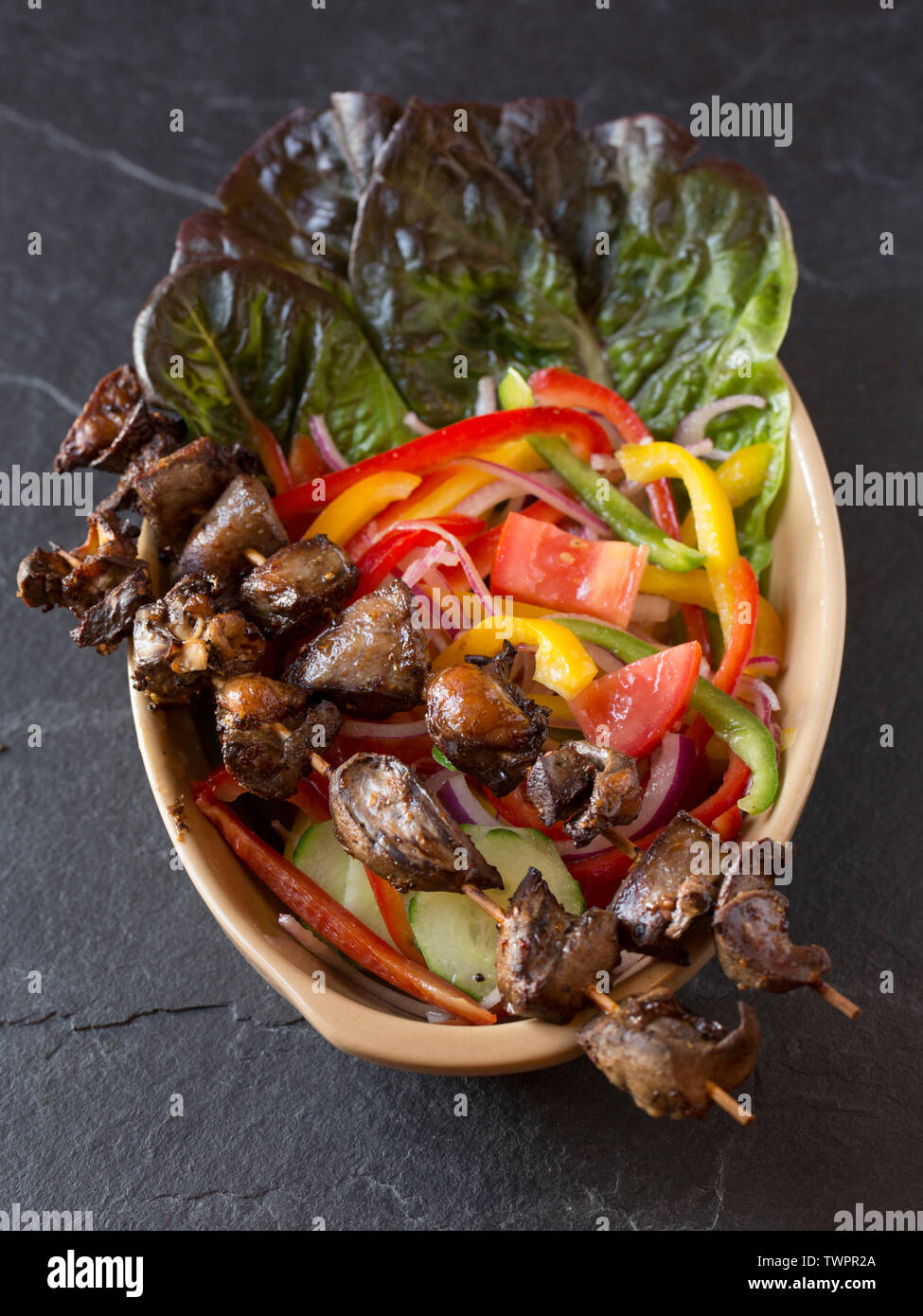 Grilled, sliced chunks of a British lamb’s heart that have been cooked ...