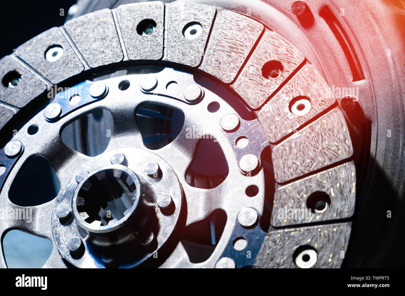 Shot of modern new spare parts for car in the muffled lighting made ...