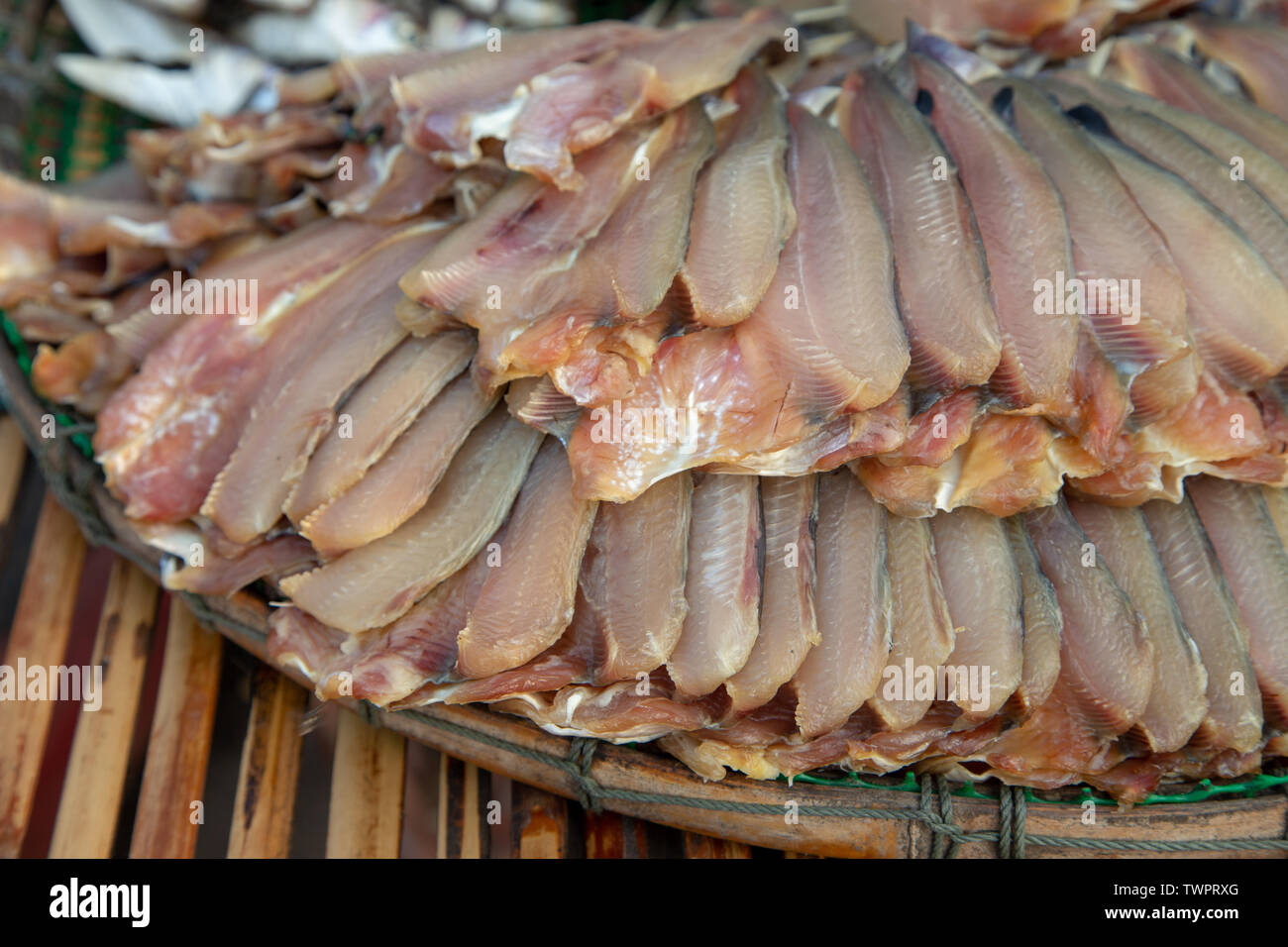 dry fresh fish on basket and sun Thai tradition for make fish to be ...