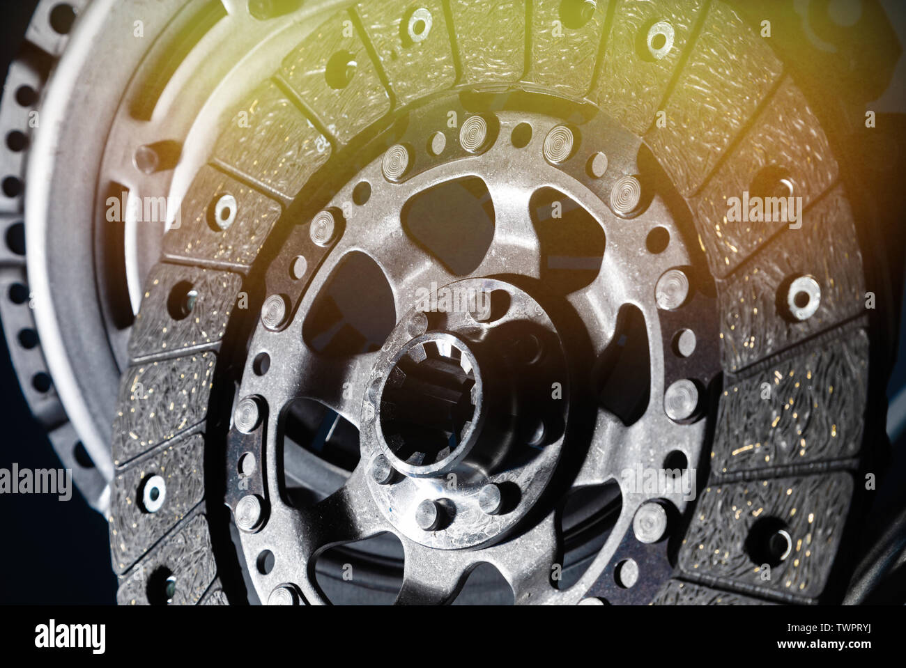 Shot of modern new spare parts for car in the muffled lighting made ...