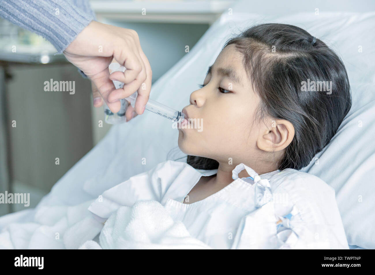 Doctor heal asian kid injection needle medicine in hospital clinic room ...