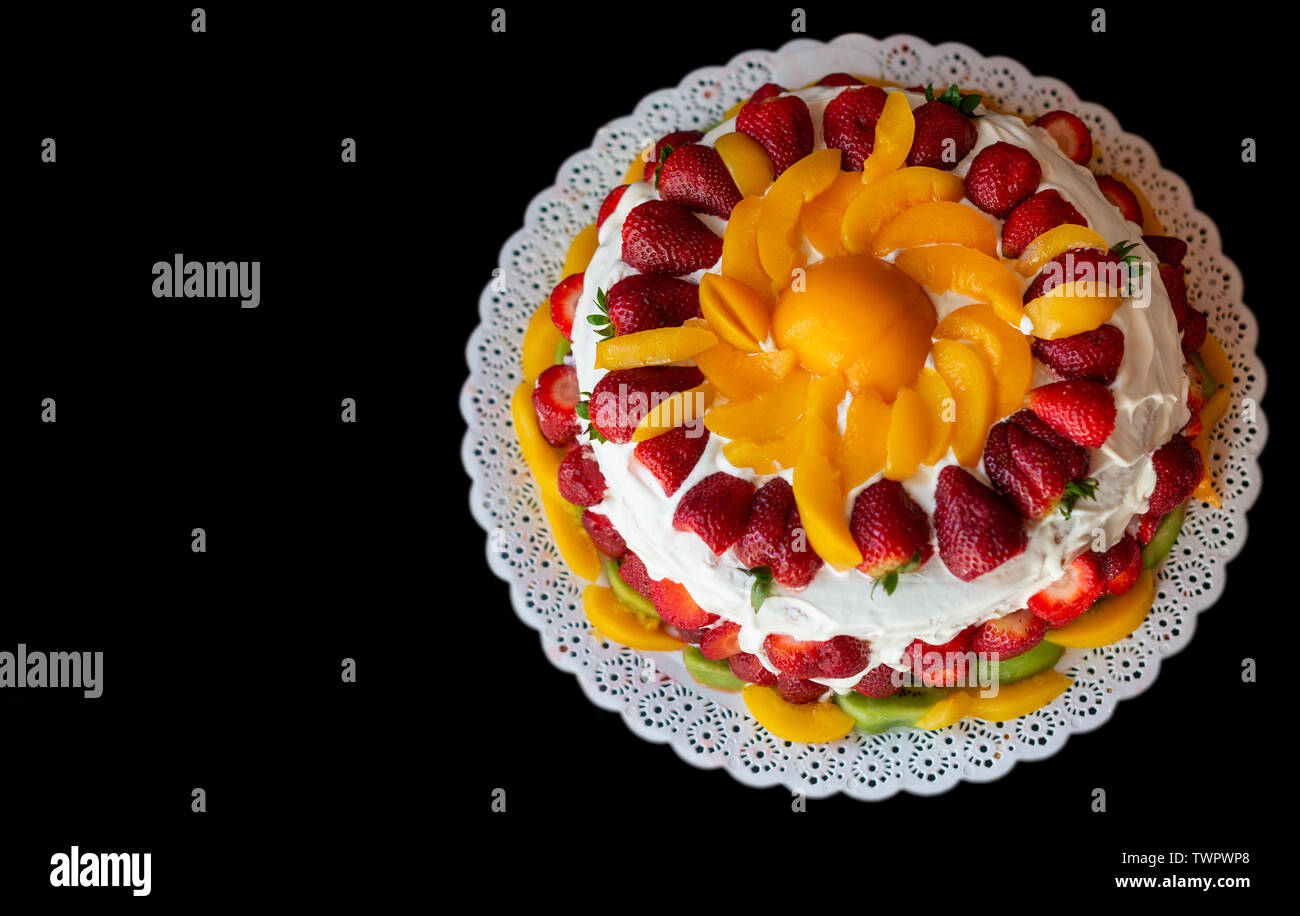 Sweet cream cake with fruits seen from above Stock Photo - Alamy