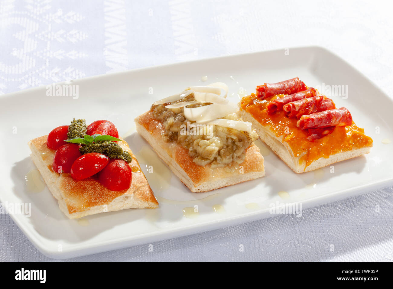 finger food aubergine salad tomatoes onion bread salami slices green ...