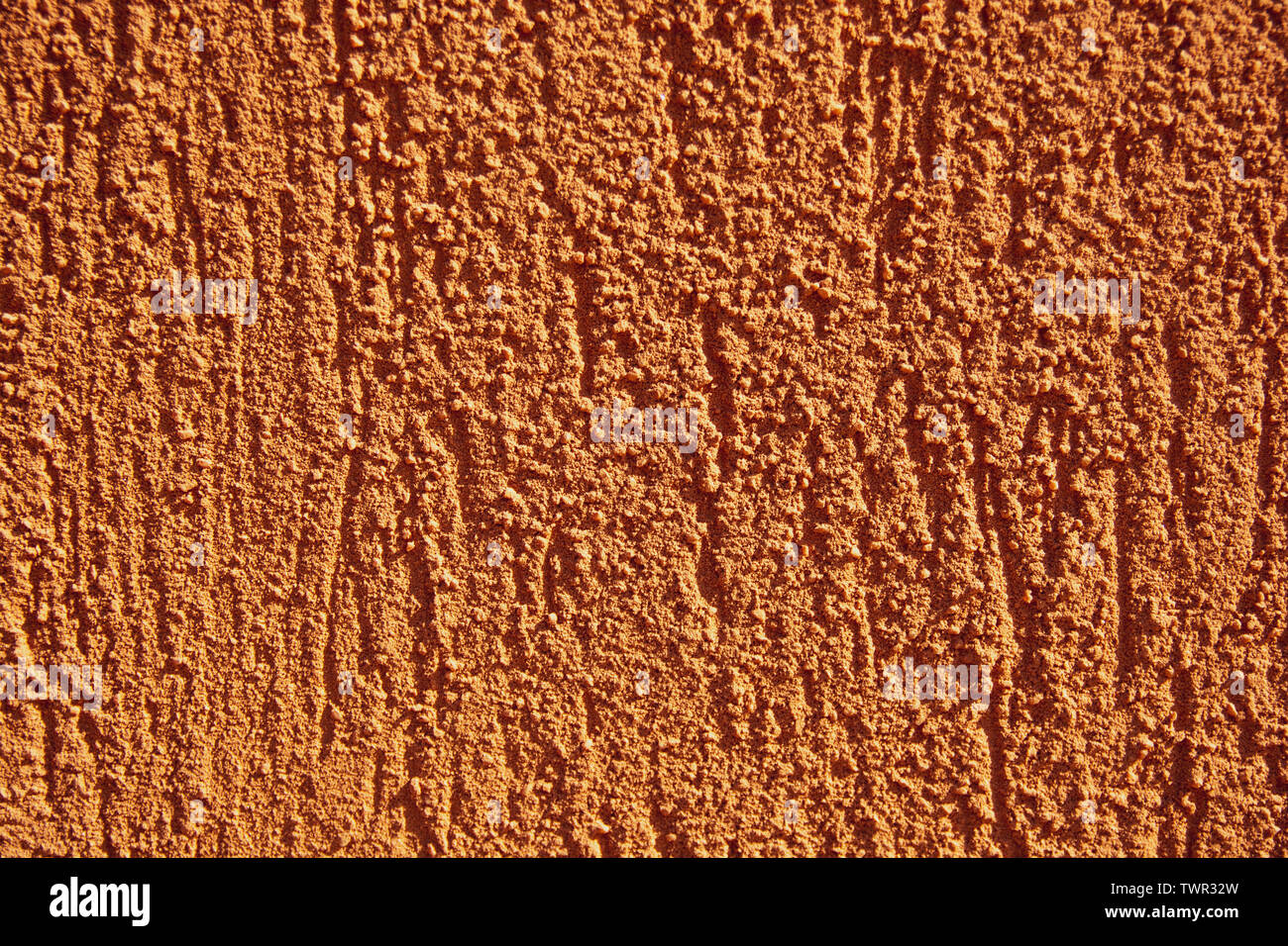 Orange colored wall with rough texture Stock Photo - Alamy