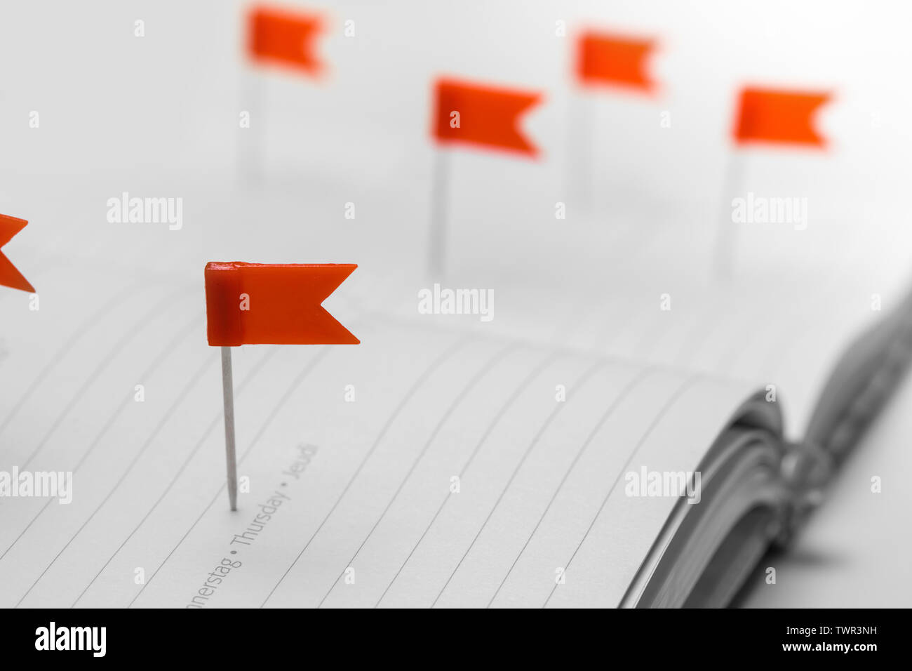 calendar with red flags marker backgroúnd Stock Photo - Alamy