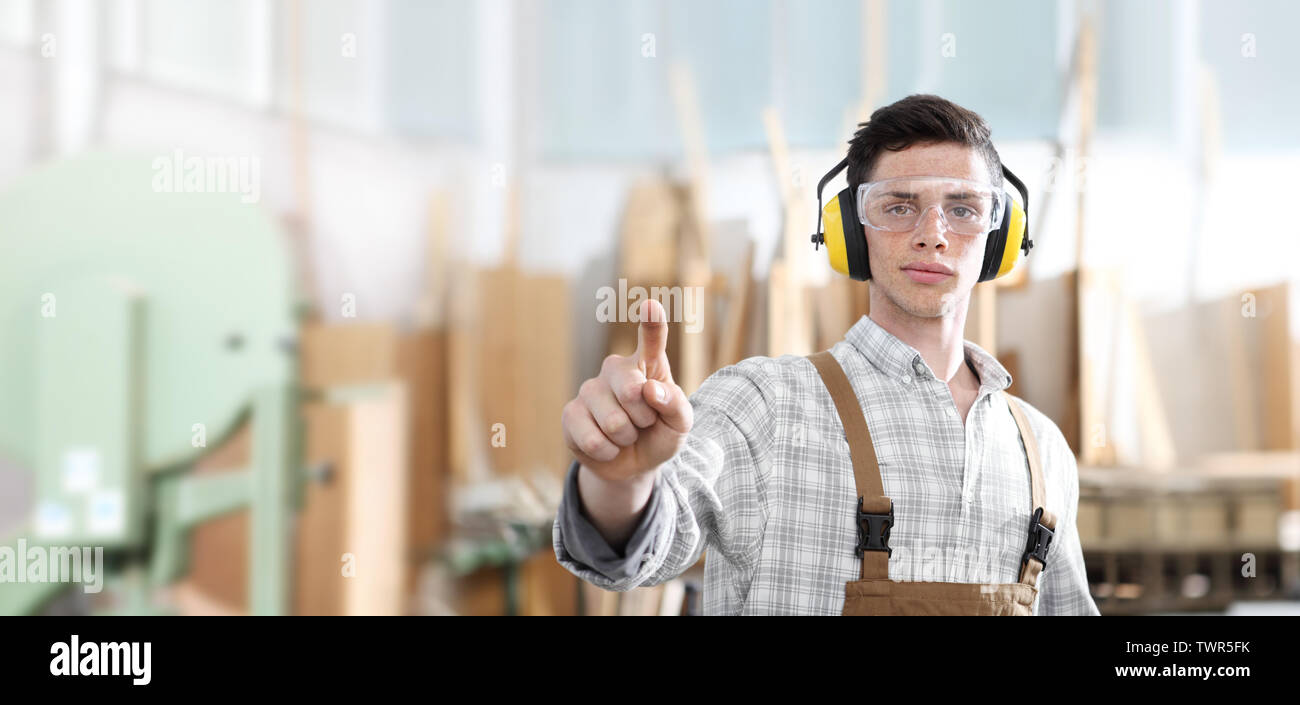 carpenter man touch screen on carpentry background Stock Photo - Alamy