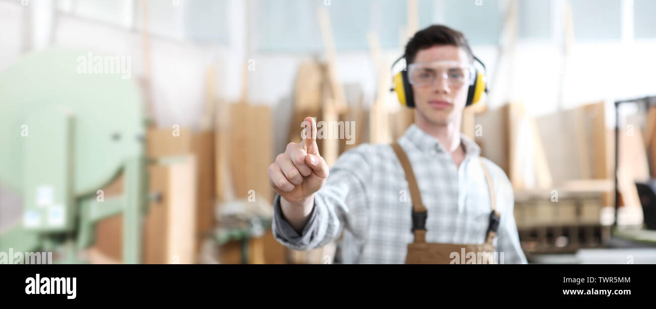 carpenter man touch screen on carpentry background Stock Photo - Alamy