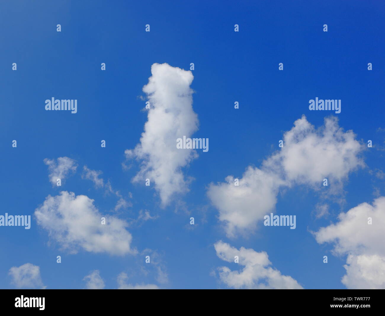 cloud patterns forming in a blue sky in summertime Stock Photo - Alamy