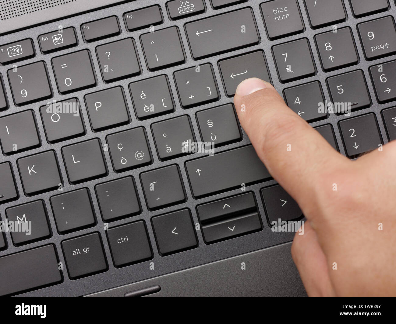 Closeup finger typing laptop keyboard Stock Photo - Alamy