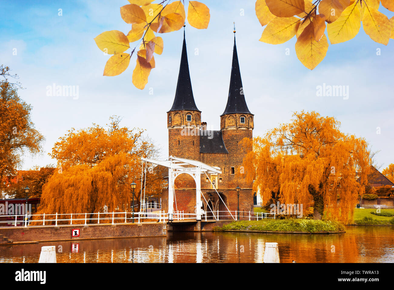 East gate with typical bridge, Delft, Netherlands at fall Stock Photo ...