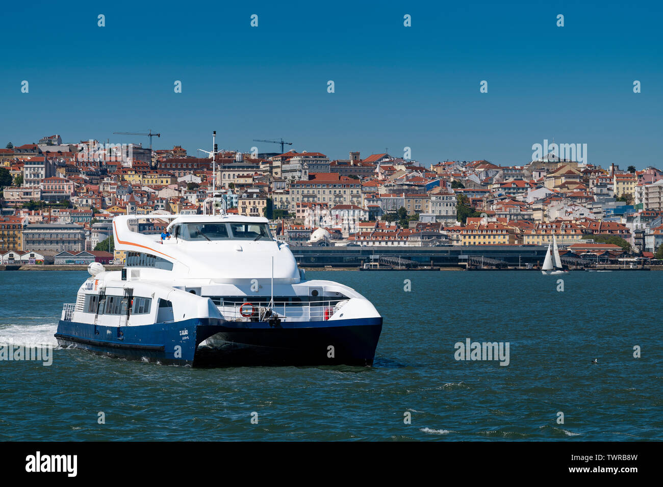 Lisbon, Portugal - June 6, 2019: A ferry boat crossing the Tagus River ...