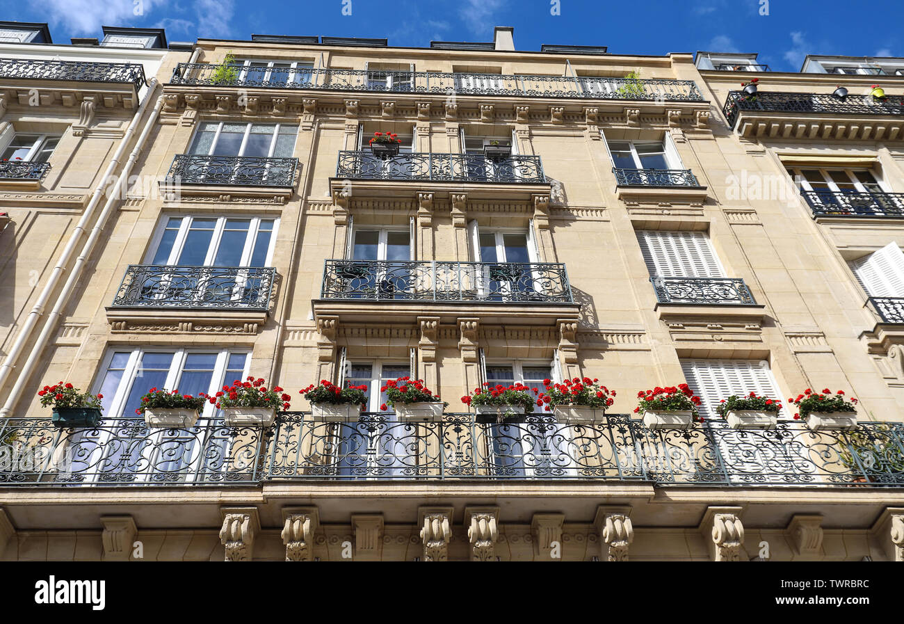 Traditional French house with typical balconies and windows. Paris ...