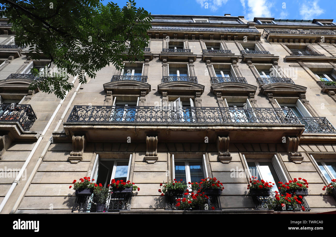 Traditional French house with typical balconies and windows. Paris ...