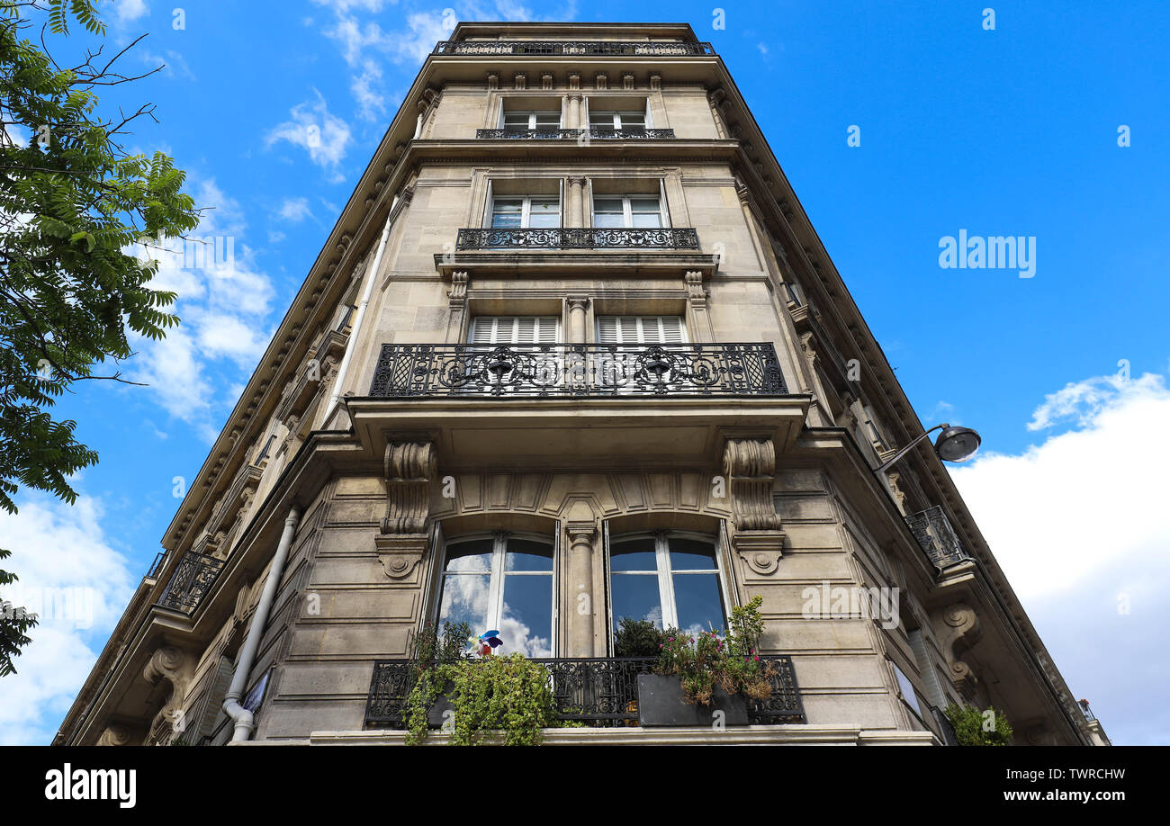 Traditional French house with typical balconies and windows. Paris ...