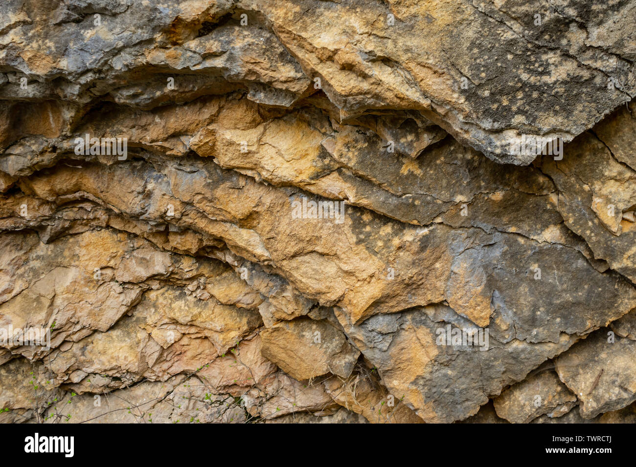 beautiful picturesque background texture of a cracked triangle rock in ...