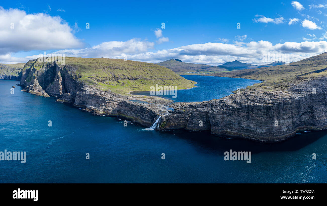 Bosdalafossur waterfall on Vagar island coastline aerial view, Faroe ...