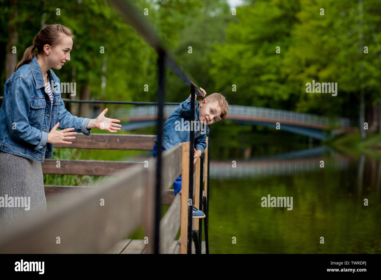 Mother is experiencing that the child will fall into the water. A ...