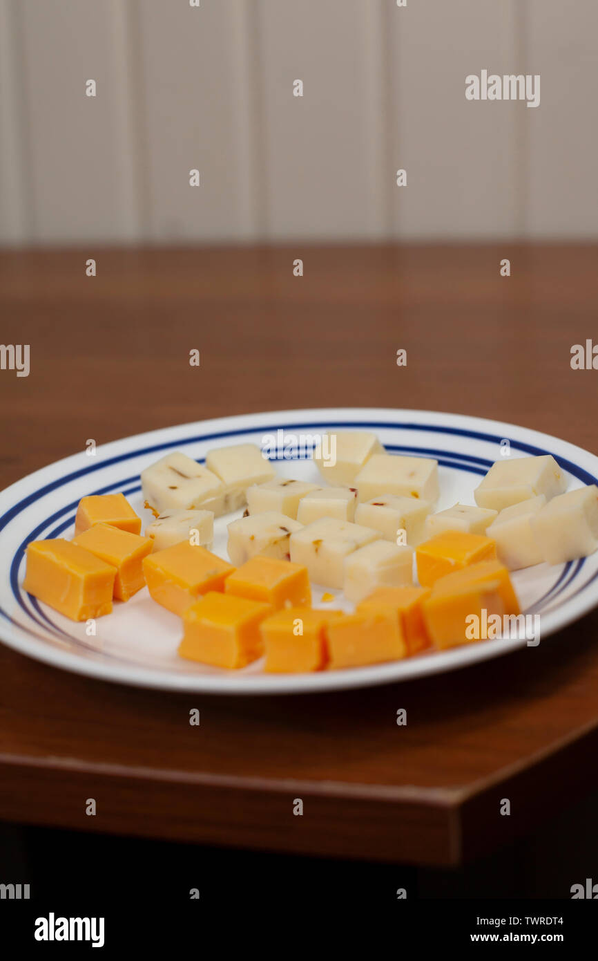 Pepperjack and cheddar cheese cubes on a serving plate Stock Photo - Alamy