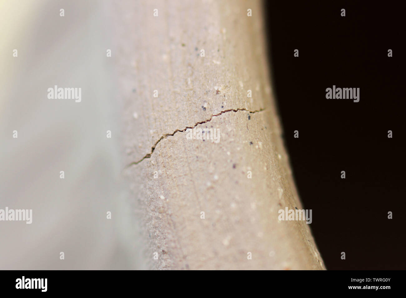 top edge of a red clay pot with crack due to fast drying and too deep ...
