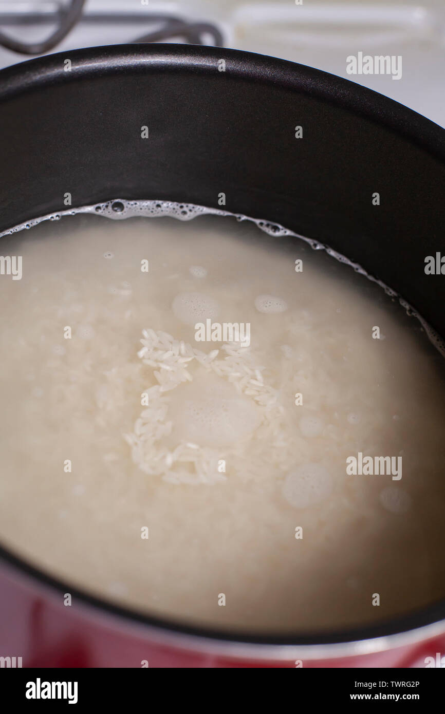 Rice boiling in a huge pot of water Stock Photo - Alamy
